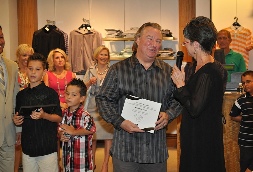 Your Observer | Photo - Michael Klauber accepts his honor from Sally Schule