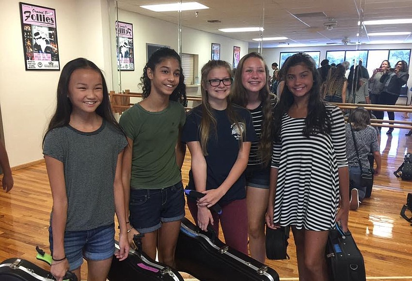 Students work on their music skills over summer at String Camp ...