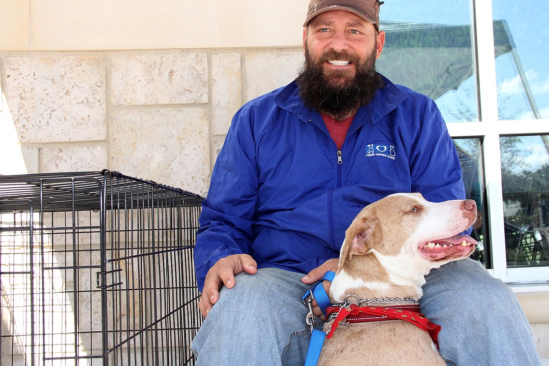 The dogs are glad Howard Tessler is a Flagler Humane Society volunteer ...