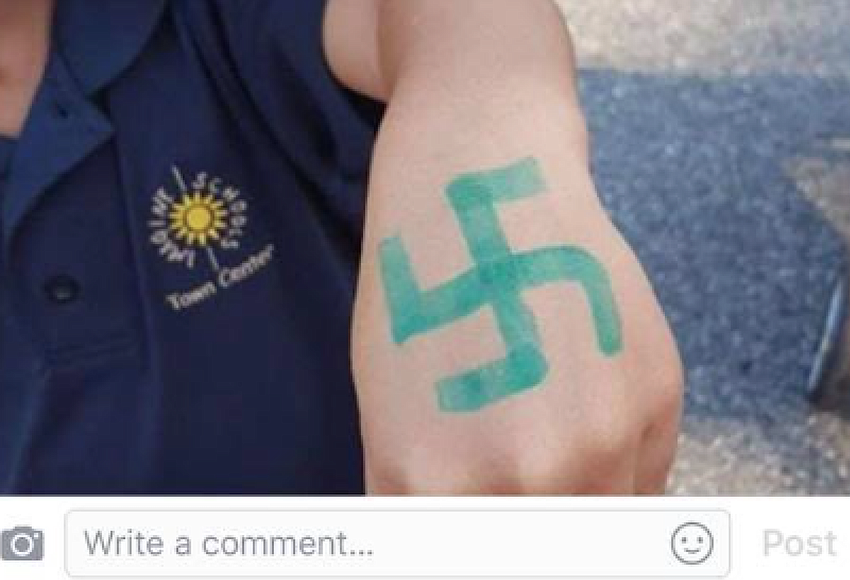 Families say young boys' hands were marked with swastikas by older boy ...