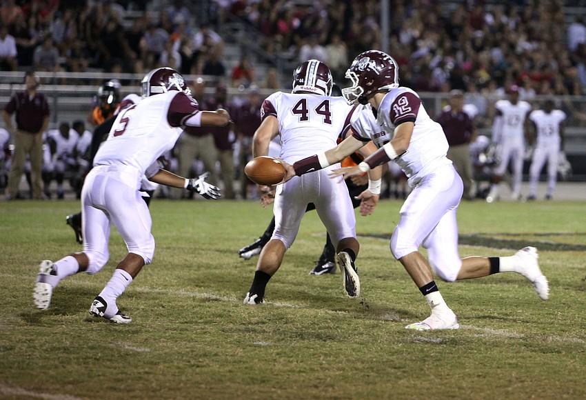 Your Observer | Photo - Dominic Marino, No. 12, passes the ball off to ...