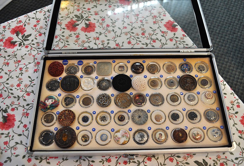 Your Observer | Photo - One of the many cases of buttons on display Sunday, Jan. 6, at the ...