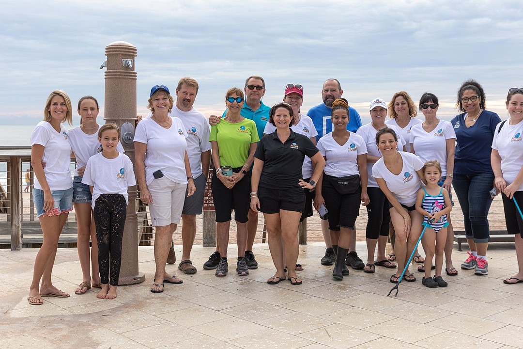 Adams Cameron & Co. Realtors host beach service project | Observer ...