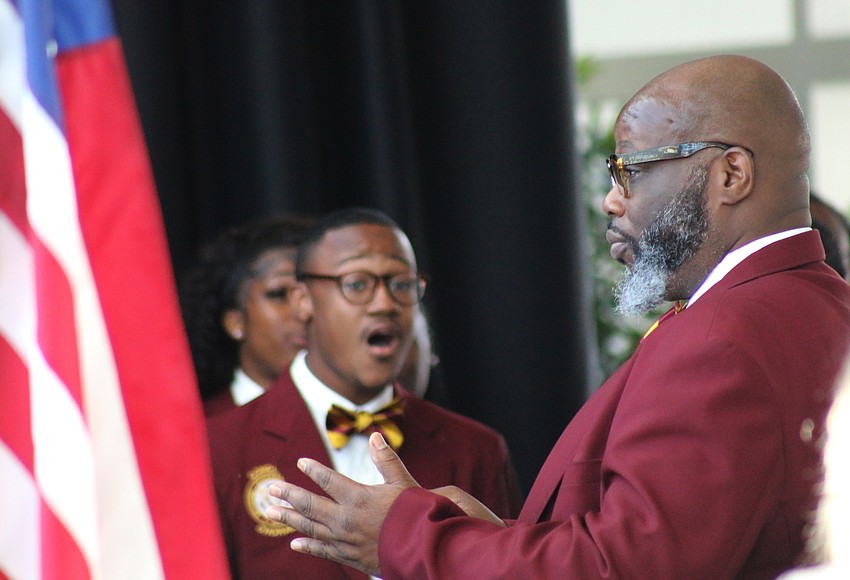 Business Observer | Photo - Choral director Terrance Lane conducts the ...