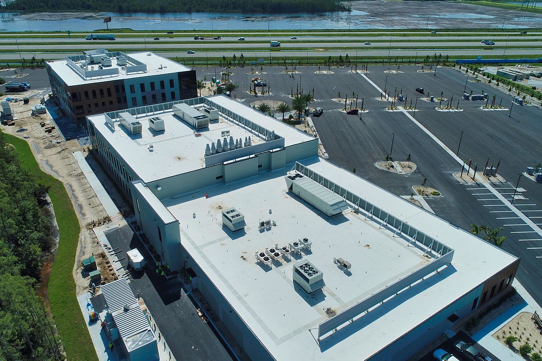 Developer builds successful niche with company HQs | Business Observer