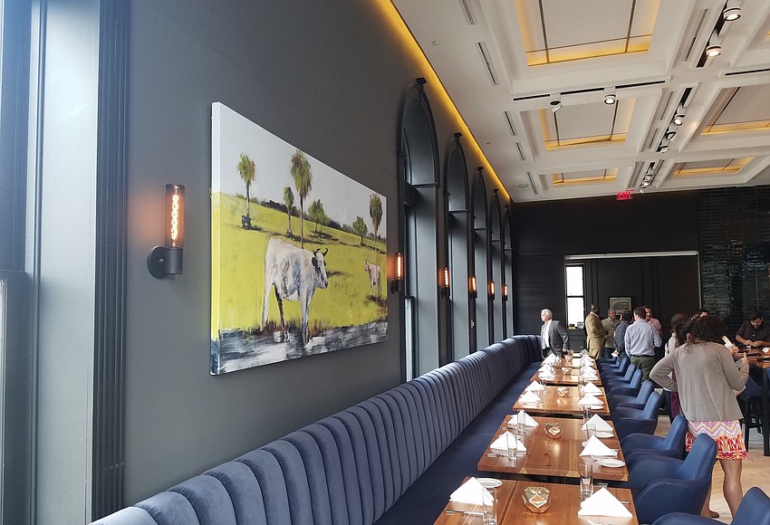Jax Daily Record| Photo - Paintings by Jim Draper are featured in the restaurant.