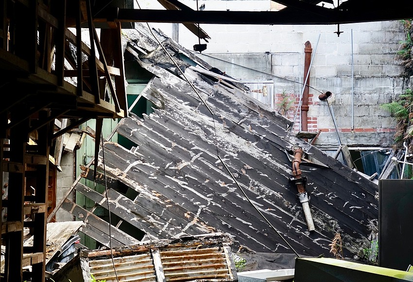 Jax Daily Record| Photo - Part of the roof inside the building is caved in.