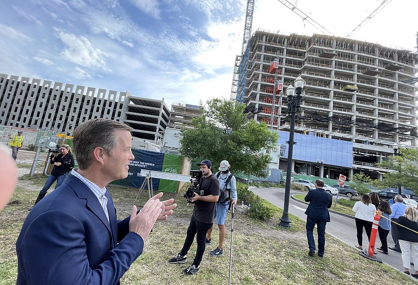 Jax Daily Record| Photo - FIS CEO Gary Norcross watches as the steel ...