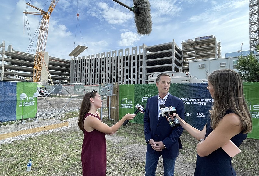 Jax Daily Record| Photo - TV reporters interview FIS CEO Gary Norcross ...