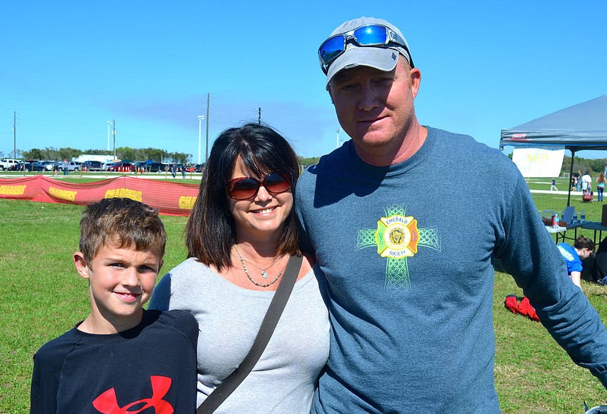 Your Observer | Photo - Tanner Crump, 9, with Lori and Paul Reda.