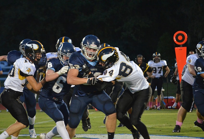 Your Observer | Photo - Linebacker Maxime Provost pushes through Bishop ...