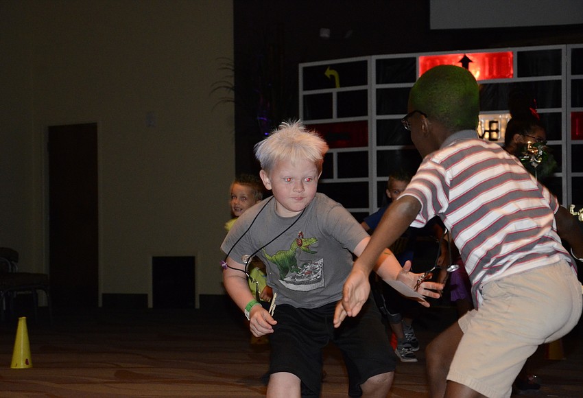 Your Observer | Photo - Evan Rowe reaches for a clothespin during a game.