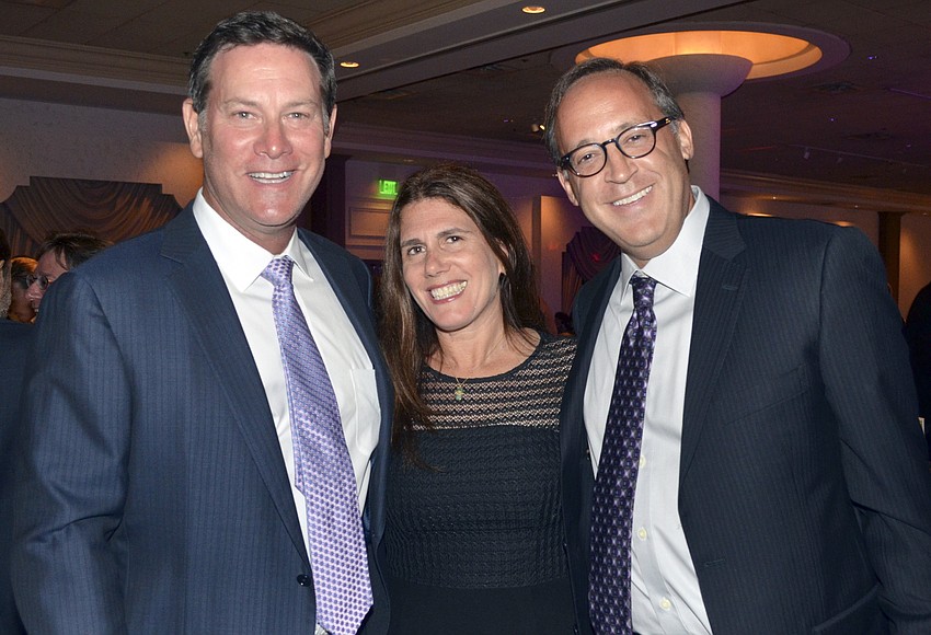 Your Observer | Photo - Richard and Elizabeth Goldstein with Craig Mallitz