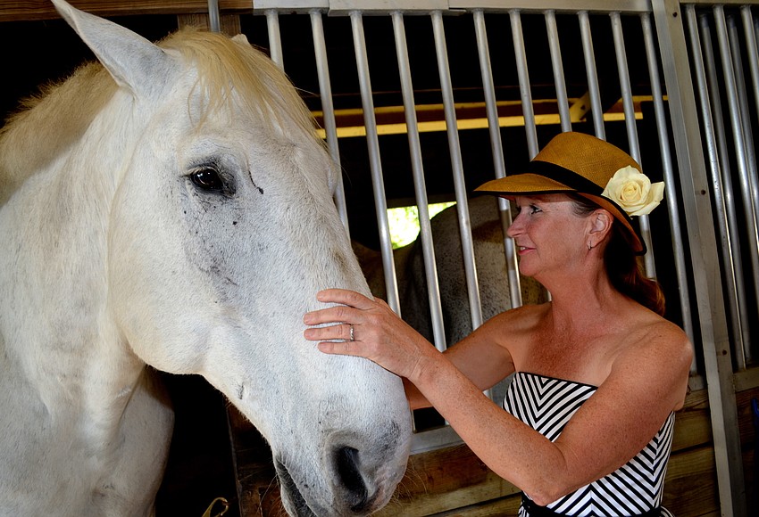 Your Observer | Photo - Sterling enjoys Julie Holt’s company in the barn.