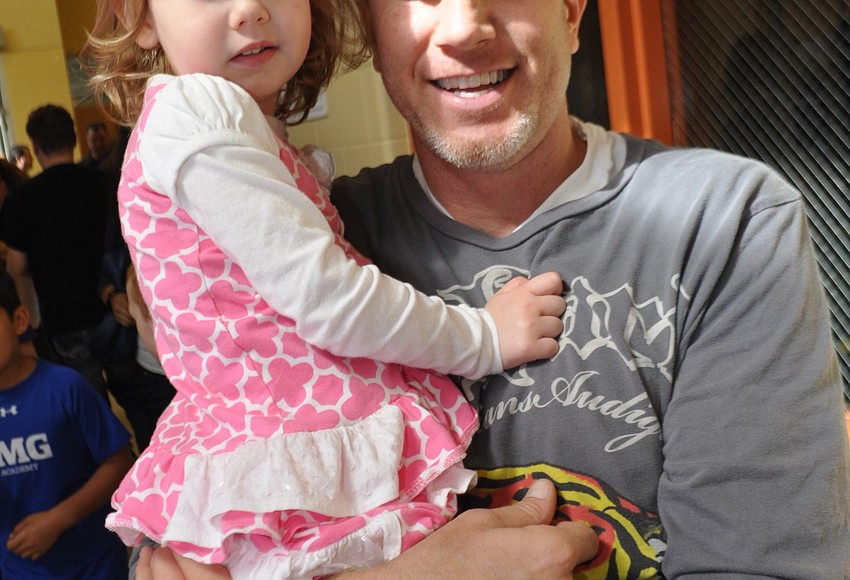 Your Observer | Photo - Daphne and Jason Quintal dance in the hallway.