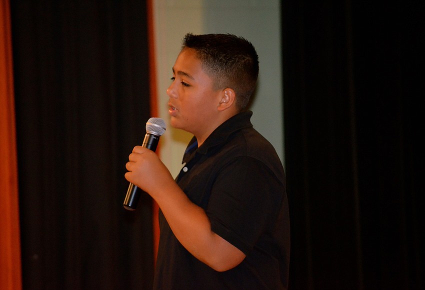 Your Observer | Photo - Marcus Gonzalez sings for the audience.