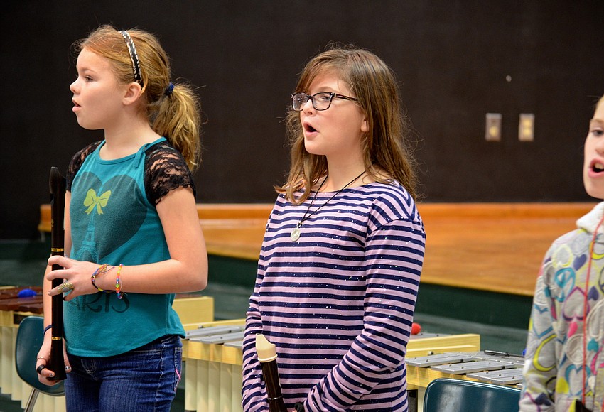 Your Observer | Photo - Alexis Hamilton sings Christmas carols.