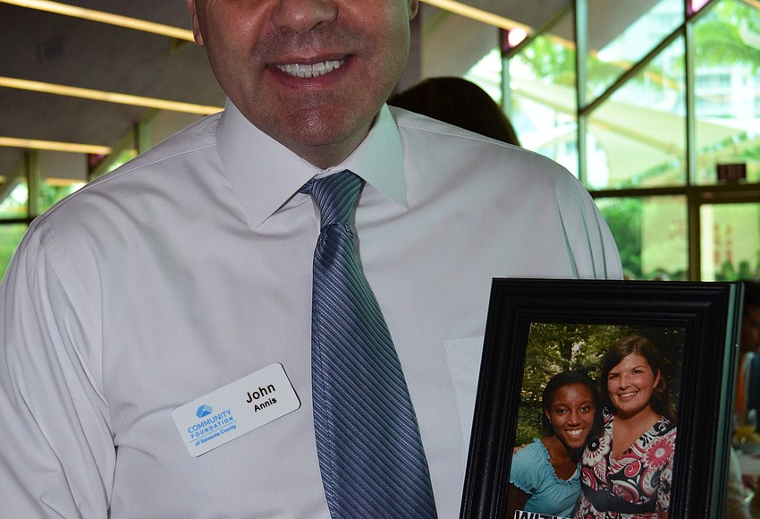 Your Observer | Photo - John Annis poses with a photo of his niece ...