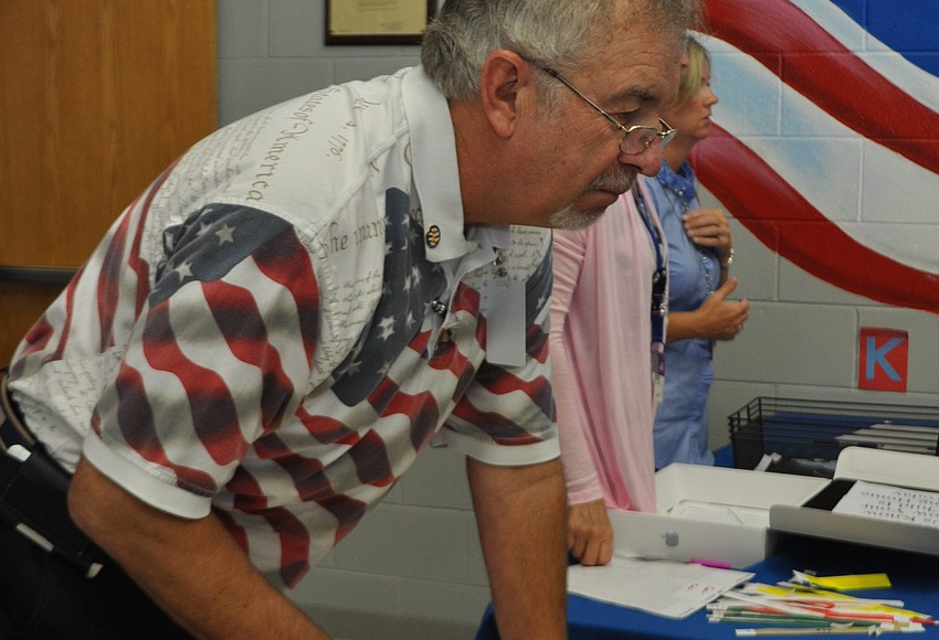 Your Observer | Photo - Founding principal, Gary Holbrook, helps with ...