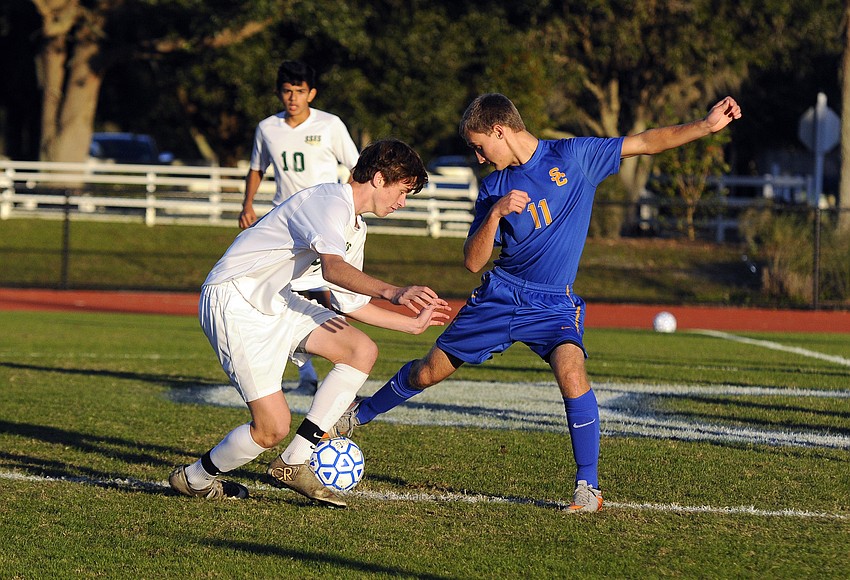 Your Observer | Photo - Sarasota Christian's Trey Lantz battles a St ...