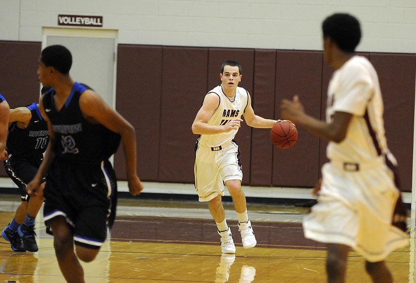 Your Observer | Photo - Riverview guard AJ Caldwell brings the ball up ...