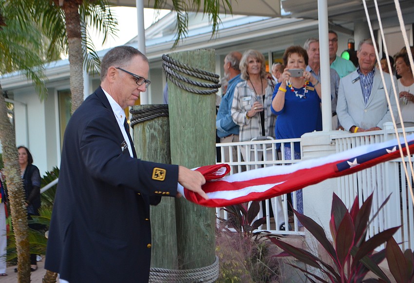 Your Observer | Photo - Rear Commodore Bob Williams folds the flag ...