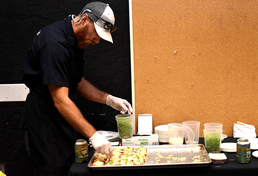 Your Observer | Photo - Robin Neff garnishes Indigenous’ baked lionfish ...