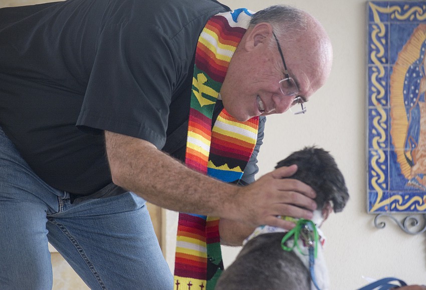 Your Observer | Photo - Pastor Wayne Farrell blesses Walter the dog ...