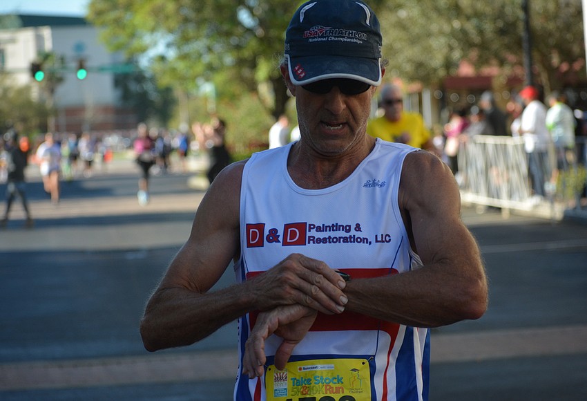 Your Observer | Photo - Sarasota's Andrew Swanson checks his time after ...