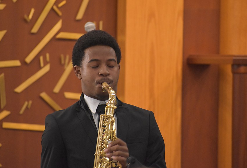 Your Observer | Photo - Jordan Bolds plays the saxophone during the ...