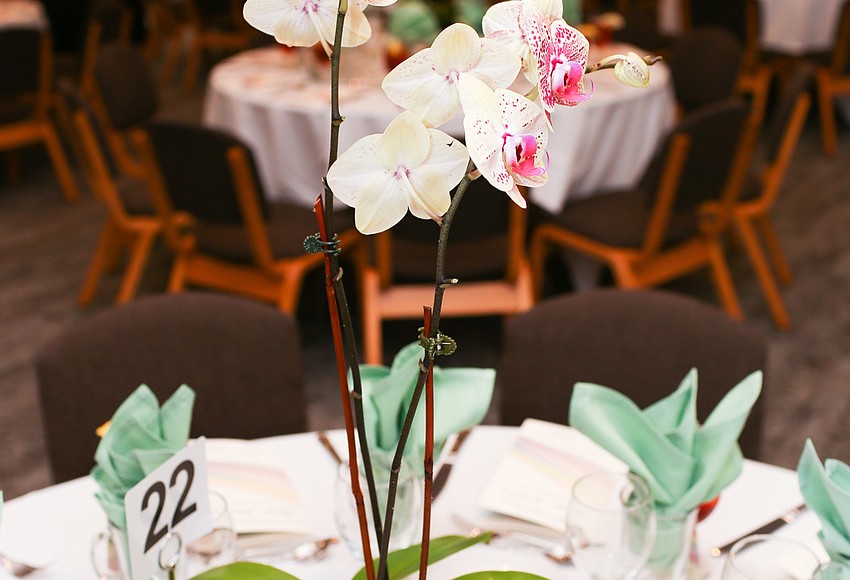 Your Observer | Photo - Orchids decorated the tables.