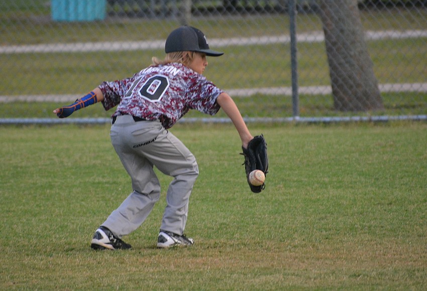 Your Observer | Photo - Landon Marazon makes a play in center field.