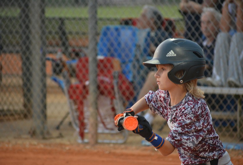 Your Observer | Photo - Landon Marazon attempts a bunt in his Minors game.