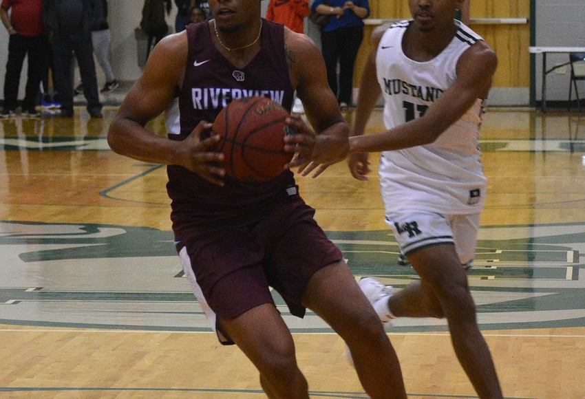Your Observer | Photo - Riverview's Tyrus Jackson drives the lane.