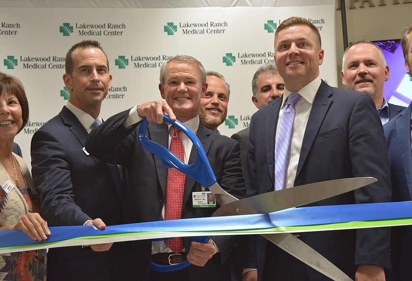 Your Observer | Photo - In front: Hospital board member Bryan Boudreaux ...