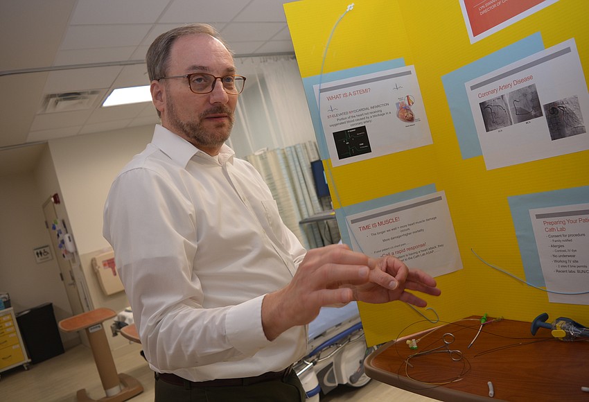 Your Observer | Photo - Hospitalist Dr. Andrew Faber explains to guest ...