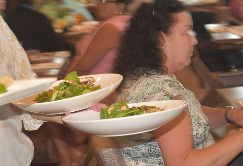 Your Observer | Photo - Food whizzed past to get to hungry attendees.
