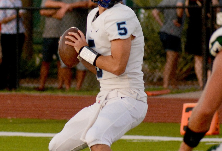 Your Observer | Photo - ODA quarterback Tyler Beasley looks for an open ...