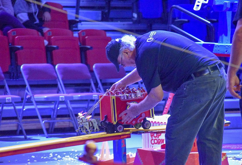 Your Observer | Photo - One of the circus science engineers fixes part ...
