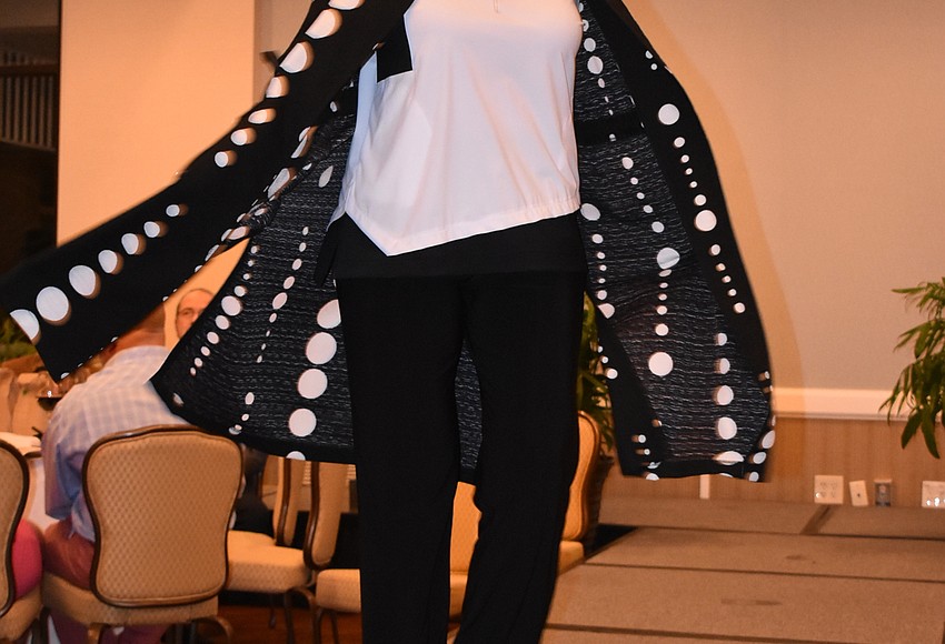 Your Observer | Photo - Lynn Christensen twirls in her sweater.