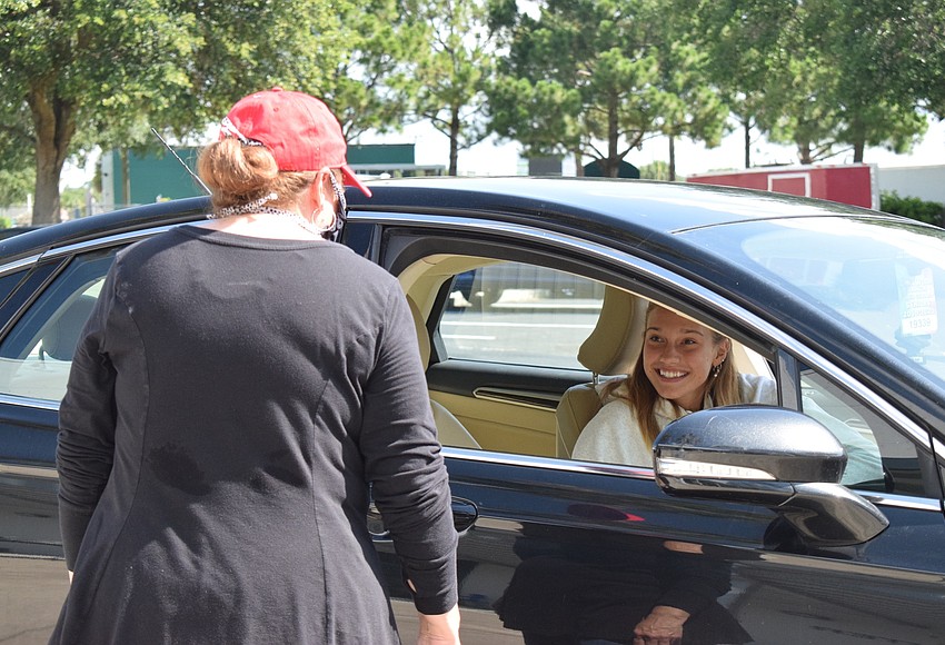 Your Observer | Photo - Macie Adams, a math teacher, talks to senior ...