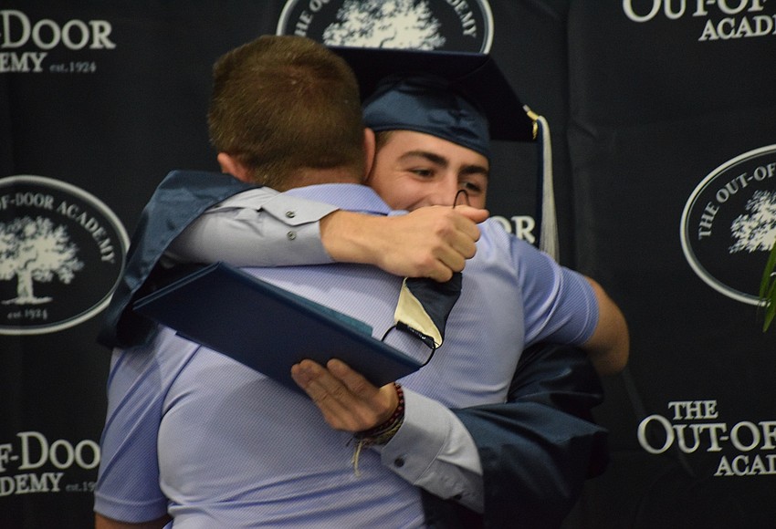 Your Observer | Photo - Michael Currier hugs his son, graduate Jarred ...