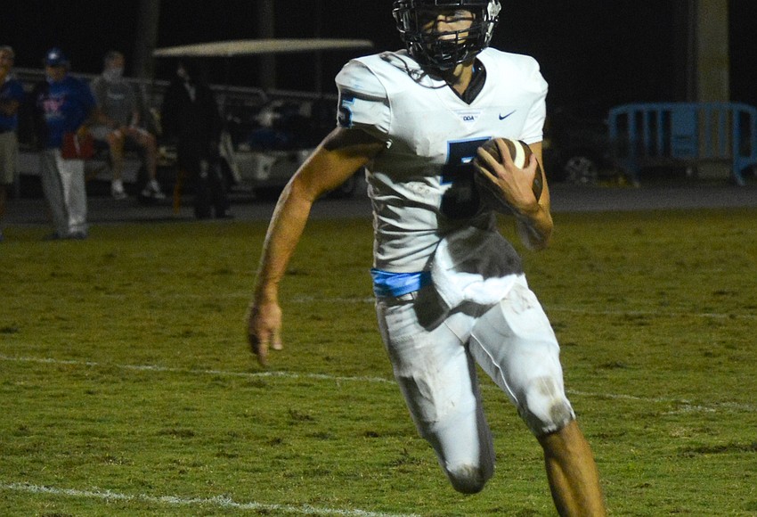 Your Observer | Photo - Tyler Beasley scampers up the field.