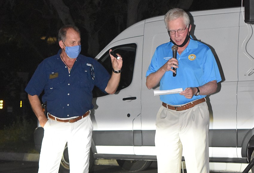 Your Observer | Photo - Mark Meador provides light for Mayor Ken Schneier.