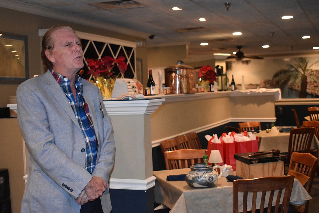 Your Observer | Photo - Jim Whitman led the meeting off with a song.