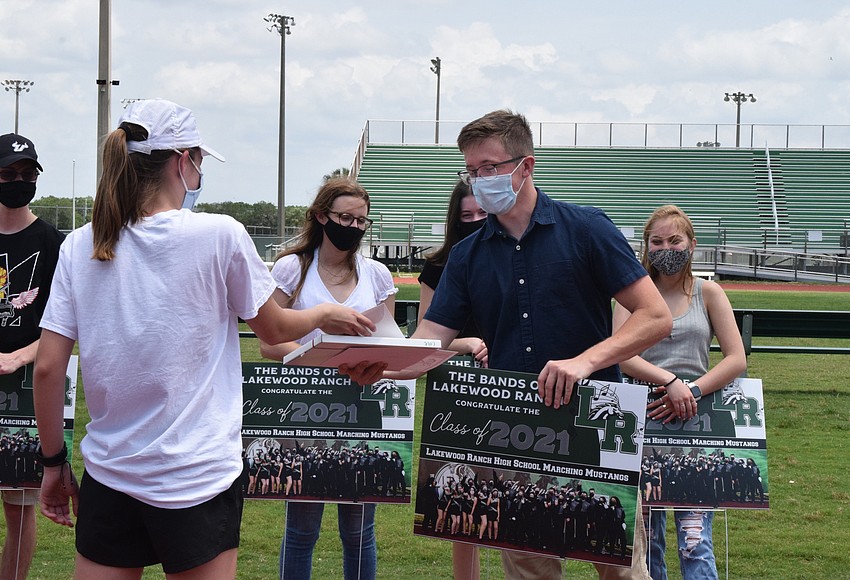 Your Observer | Photo - New drum major Maya Landers gives a certificate ...