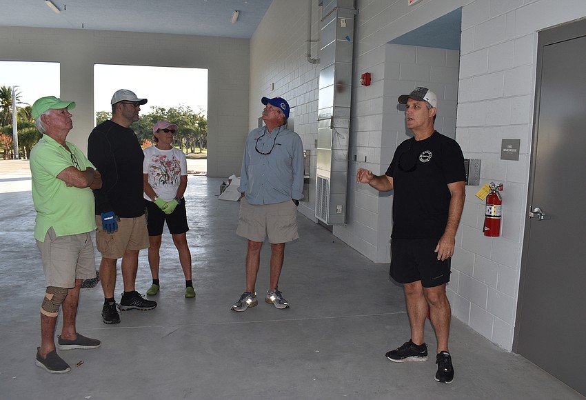 Your Observer | Photo - Paul Dezzi leads the club into the firehouse.