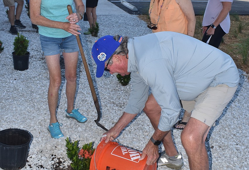 Your Observer | Photo - Mike Haycock fills in dirt.