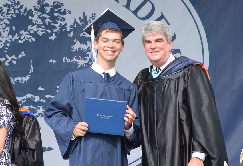 Your Observer | Photo - Senior Tyler Beasley is congratulated by David ...