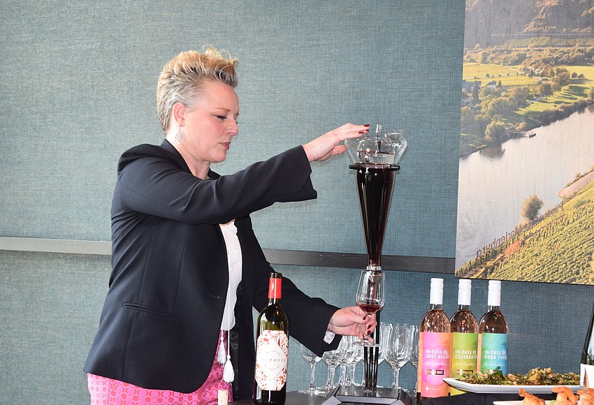 Your Observer | Photo - Cooper's Hawk Vice President Emily Wines pours ...